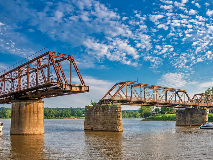 The rusted elegance of Harmar Bridge spans more than just water&mdash;it connects modern Marietta to its industrial past with steadfast iron determination.