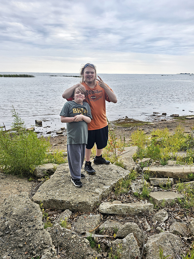 Shoreline explorers find their reward in Little Bay de Noc's gentle waters, where rocky outcroppings provide nature's perfect viewing platform.