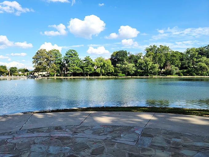 City Park's serene lake reflects Maryland's blue skies, offering a peaceful retreat where retirement dreams don't require winning the lottery first.