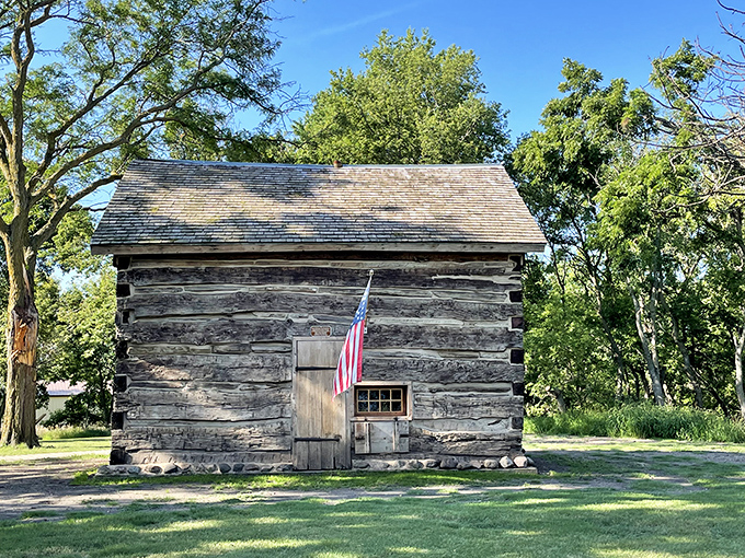 Pioneer spirit preserved! This historic log cabin stands as a humble reminder that Netflix wasn't always the evening's entertainment option.