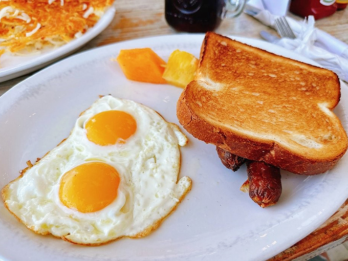 Sunny-side perfection meets golden toast in this classic breakfast that proves sometimes the simplest dishes require the most skill to execute flawlessly.