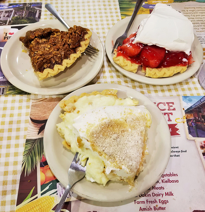 The holy trinity of pie perfection: pecan, strawberry, and cream. One slice is technically dessert; ordering all three is what we call "research."