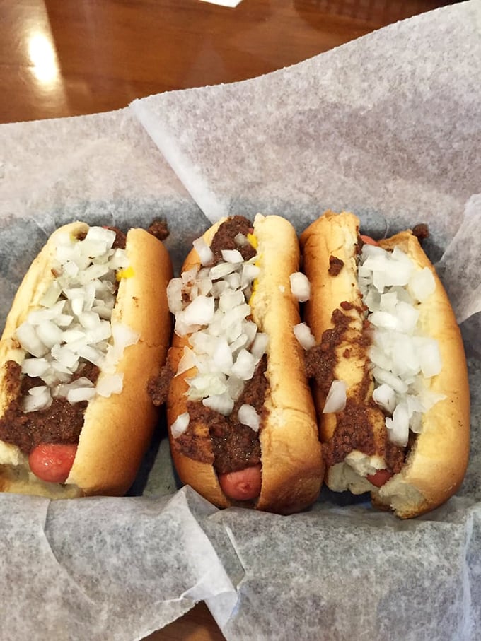 These aren't just hot dogs&mdash;they're edible masterpieces. The perfect meat-to-bun ratio, topped with chili and onions that make your taste buds stand at attention. 