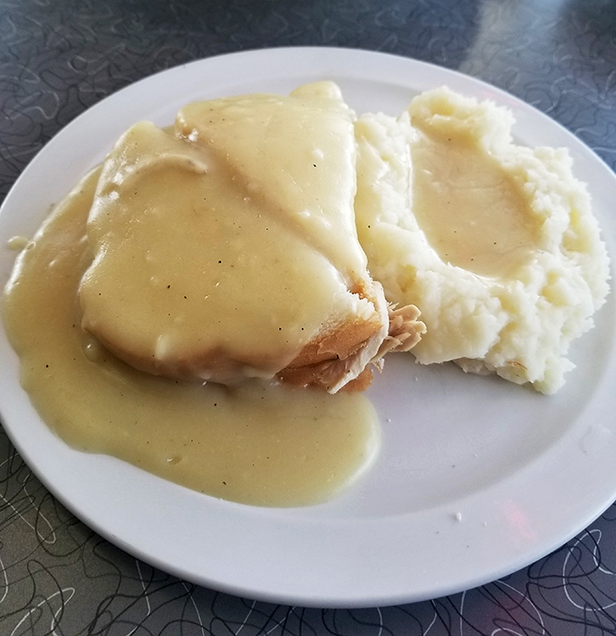 The legendary hot turkey sandwich&mdash;tender meat blanketed in gravy so good you'll want to write home about it, nestled beside mashed potatoes that could make a grown adult weep.