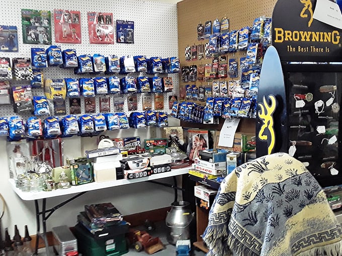 This corner could be called "Boyhood Dreams in Miniature," where Browning memorabilia meets Hot Wheels in a display that makes grown men whisper, "I had that!"