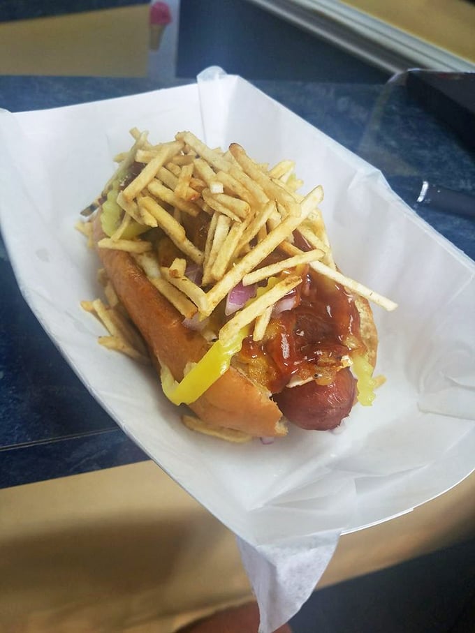 This isn't just a hot dog&mdash;it's an architectural marvel topped with crispy potato sticks that add crunch to every magnificent bite.