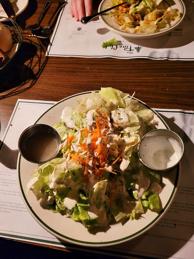 Behold the famous house salad &ndash; crisp lettuce crowned with carrots and those magical metal cups of dressing destiny.