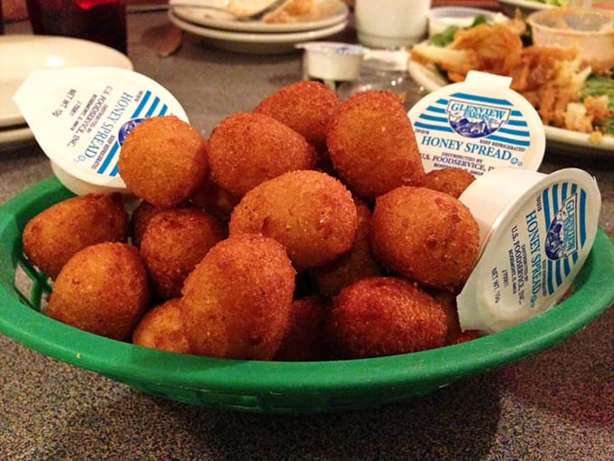 Golden-brown hush puppies that could make a Southern grandmother weep with joy. These crispy cornmeal spheres of happiness are worth the trip alone.
