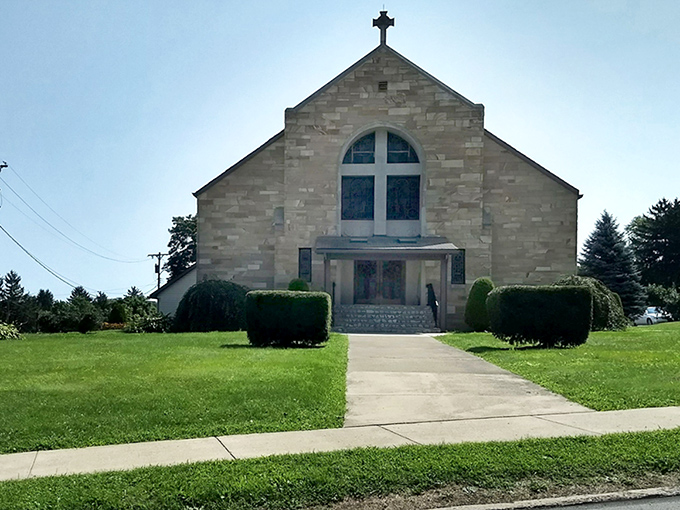 This stone church stands as a testament to faith and craftsmanship, where Sunday best still means something and potlucks are competitive sports.