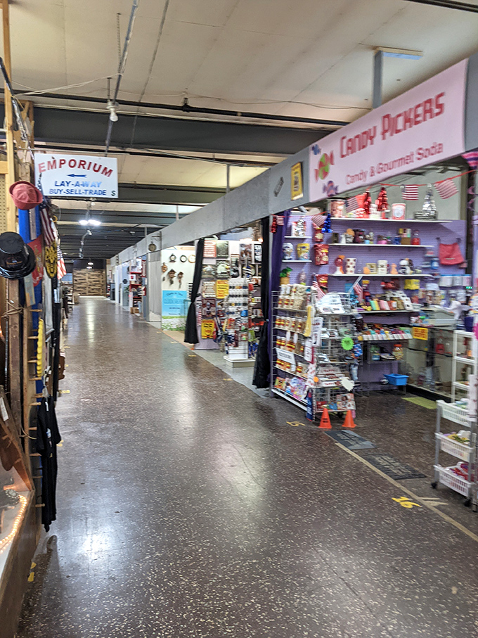Long corridors lined with vendor stalls create a labyrinth of discovery. The Candy Pickers' colorful display is just one sweet spot in this vast marketplace.