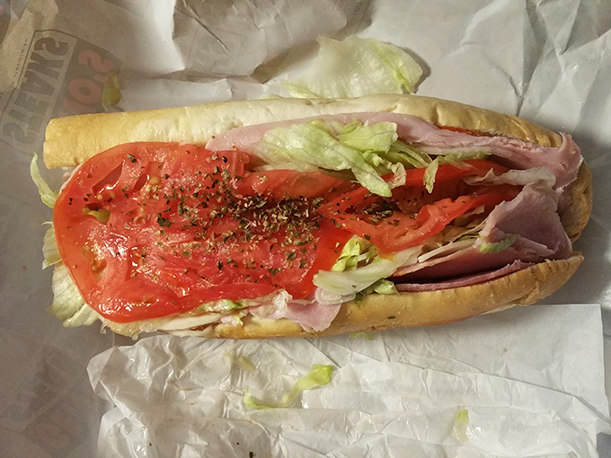Layer upon layer of Italian cold cuts, fresh veggies, and that perfect drizzle of oil. The hoagie that launched a thousand food pilgrimages.