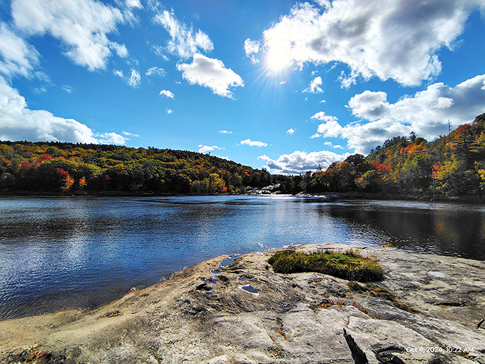 Nature's paintbrush goes wild during fall at this serene waterfront spot, where the Androscoggin River reflects autumn's glory in a mirror of tranquil perfection.