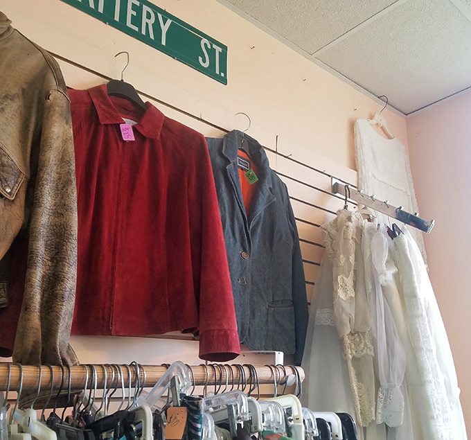 Where jackets go for their second act. That Battery Street sign watches over vintage treasures like a benevolent fashion guardian.