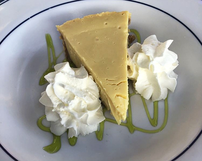 This key lime pie isn't just dessert; it's Florida's edible sunshine - the perfect balance of tart and sweet with a graham cracker crust that deserves its own fan club.