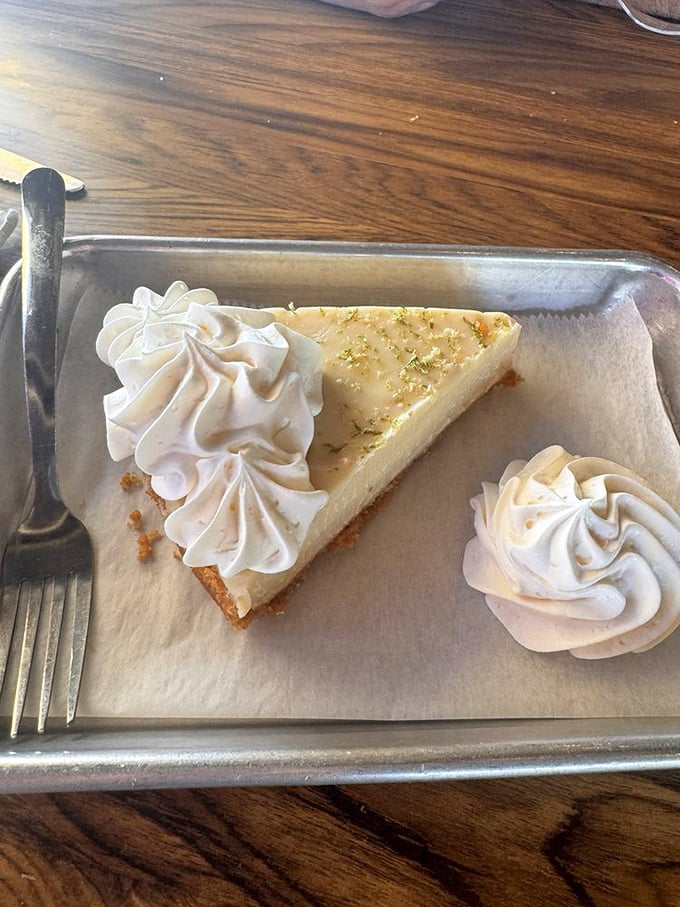This slice of key lime pie achieves the perfect tart-to-sweet ratio – the culinary equivalent of finding the perfect beach spot.
