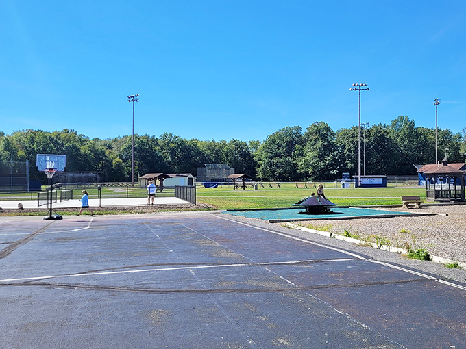 A community baseball field where dreams are still measured in home runs rather than social media likes. Pure Americana under Pennsylvania's blue skies.