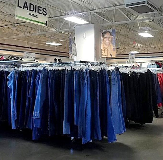 Denim democracy in action—every shade of blue, organized with military precision. Finding your perfect pair feels like winning a small lottery without buying a ticket.