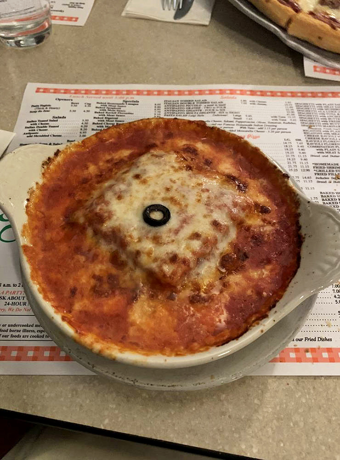 This bubbling cauldron of cheese isn't just lasagna &ndash; it's a spiritual experience with a black olive blessing on top.