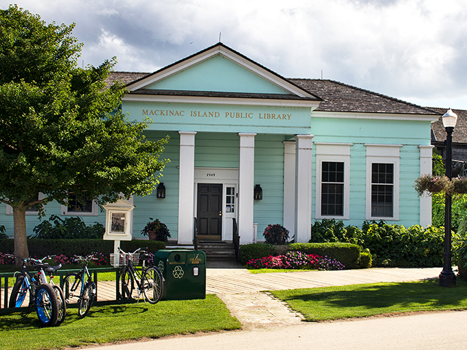 The Mackinac Island Public Library offers a mint-colored slice of tranquility, where even the bicycles parked outside seem to be taking a literary break.