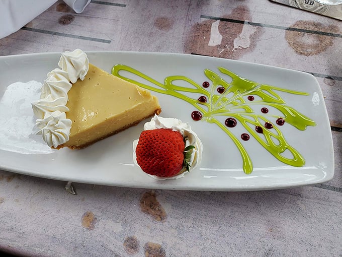 Key lime pie so perfectly balanced between tart and sweet, it could teach a masterclass in dessert diplomacy. That artful green drizzle? Pure Florida showmanship.