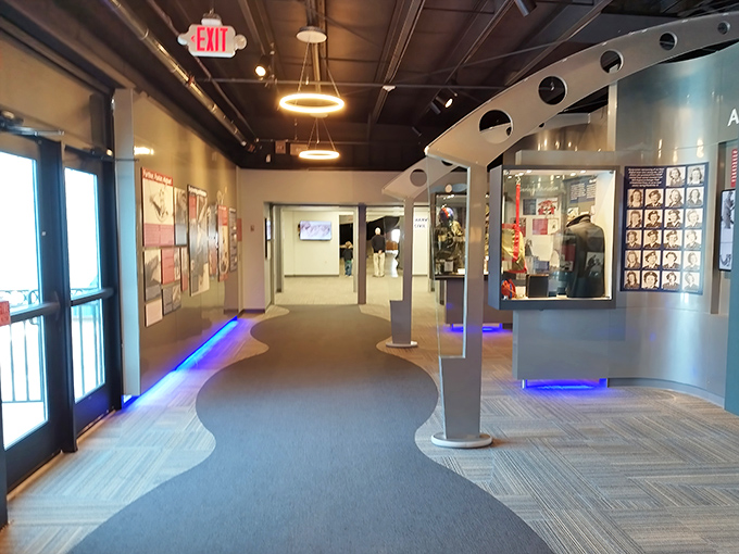 The museum's modern entryway sets the stage for your journey through aviation history. Blue lighting guides visitors like runway lights beckoning planes home.