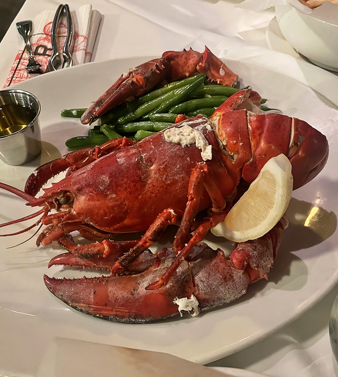 The star of the show in all its crimson glory. This Maine lobster, paired with green beans and drawn butter, is what seafood dreams are made of.