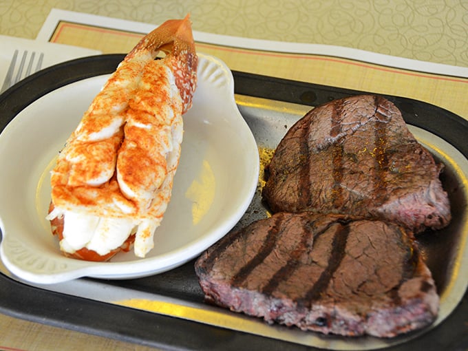 The surf and turf that launched a thousand road trips. That lobster tail isn't just dinner&mdash;it's the reason people drive from three counties away.