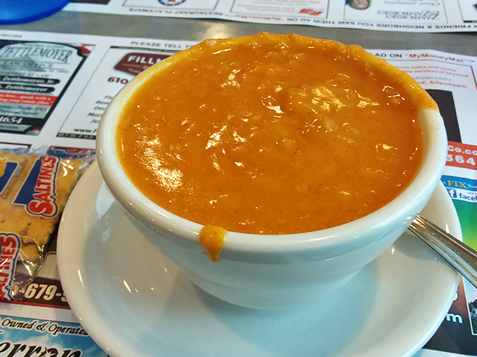 This isn't just soup&mdash;it's liquid sunshine in a bowl. The lobster bisque's vibrant orange hue hints at the rich, velvety decadence waiting for your spoon.