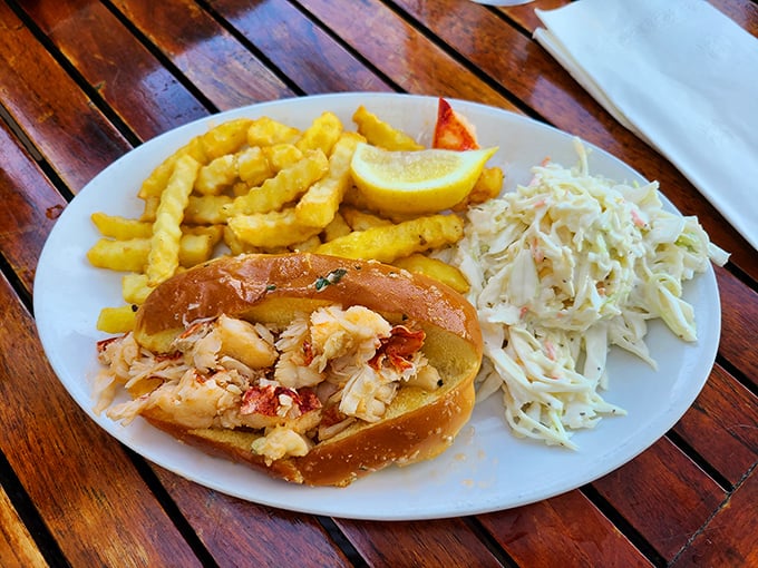Not just a sandwich but a celebration – chunks of sweet lobster nestled in buttery bread with crispy fries standing guard.