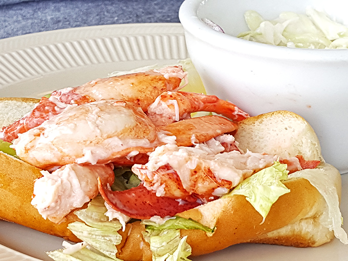 Lobster roll perfection: chunks of sweet meat barely contained by their buttery vessel. This isn't lunch; it's edible poetry.