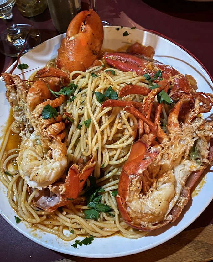 The legendary lobster spaghetti arrives like a seafood crown atop perfectly al dente pasta&mdash;this isn't dinner, it's an event.