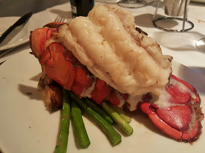 This isn't just lobster&mdash;it's a crustacean masterpiece. Tender meat perched atop asparagus spears like Neptune's own dinner choice.