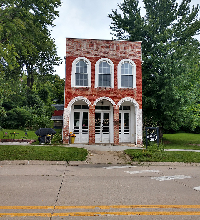 This charming brick storefront with its elegant arched windows could convince even the most dedicated city-dweller that small-town life has its perks.