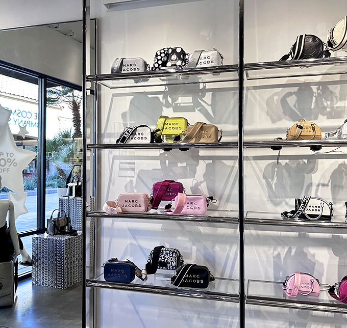 Marc Jacobs bags lined up like beauty contestants on glass shelves. Each one silently whispering, "Take me home, I'm 60% off!"