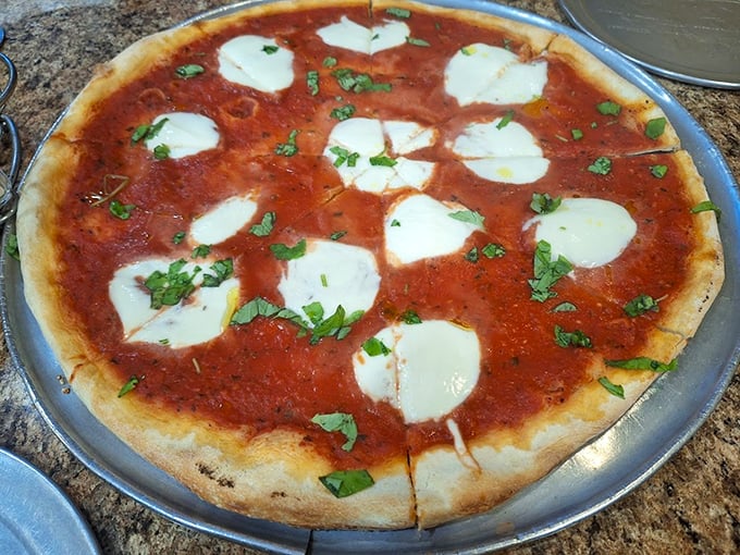 This Margherita pizza isn't just food&mdash;it's edible artwork with pools of melted mozzarella floating on a sea of vibrant tomato sauce.