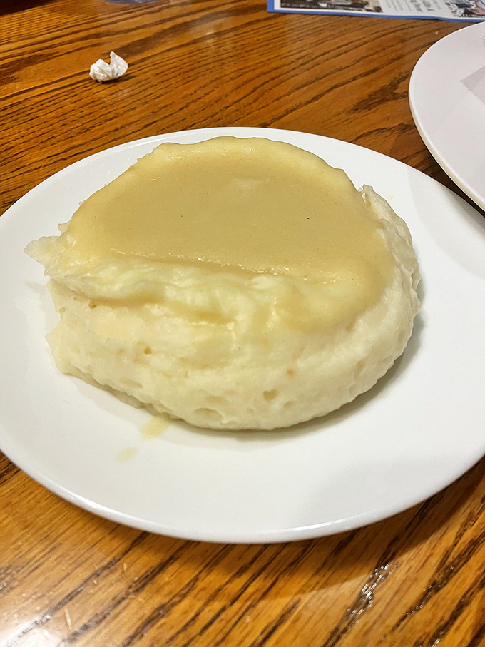 Behold the star attraction: mashed potatoes so perfectly whipped and buttery, they've caused spontaneous happy dances at countless tables.