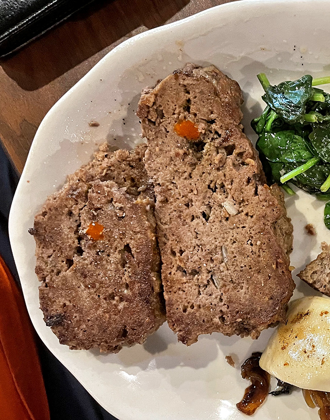 The star of the show: meatloaf that doesn't need fancy presentation to impress. Those little carrot pieces are like buried treasure for grown-ups.
