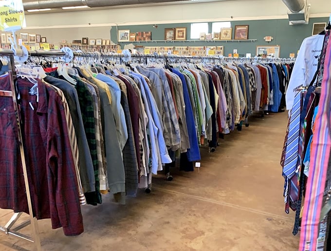 The men's clothing section: where flannel shirts and business attire hang side by side like old friends catching up after years apart.