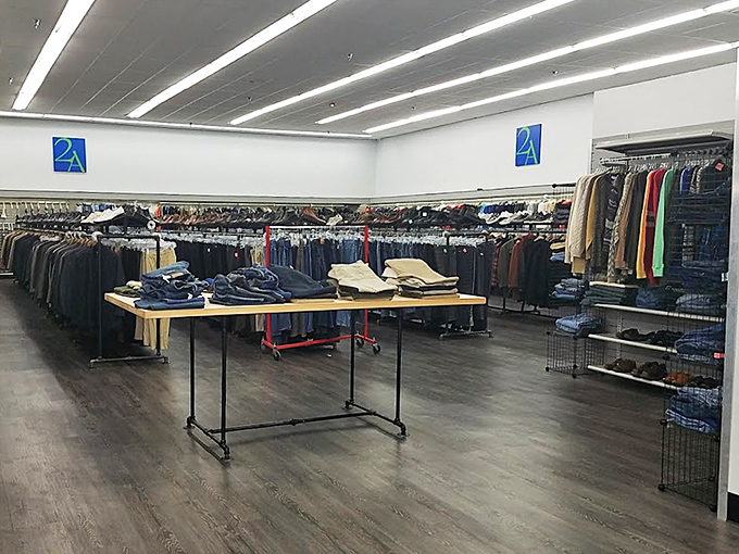 The men's department: where yesterday's business attire awaits its second career interview, neatly arranged by size and style.