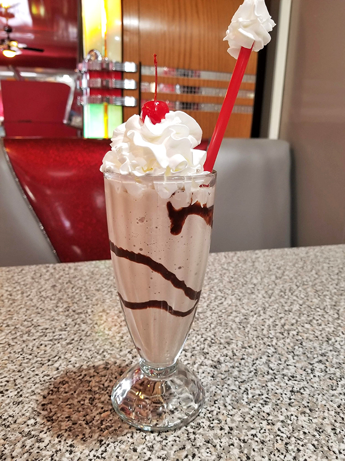 Not just a milkshake, but a work of art. Those chocolate swirls, whipped cream mountain, and cherry on top make diets disappear faster than Elvis left the building.