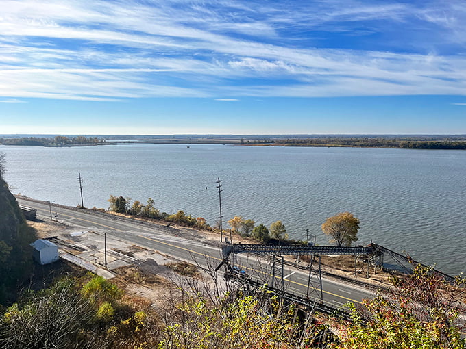 The Mississippi River stretches toward the horizon like nature's highway, a constant companion to Alton's everyday rhythms.