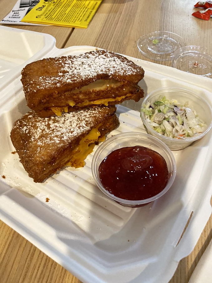 Behold the Monte Cristo in all its glory&mdash;golden-fried perfection dusted with powdered sugar, with jam and coleslaw standing by as willing accomplices.