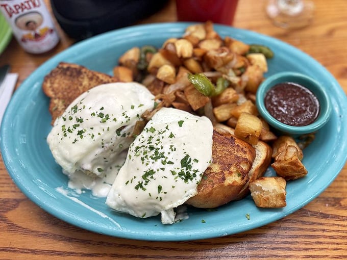 Behold the Monte Cristo's sophisticated cousin! Creamy b&eacute;chamel blankets golden French toast while those potatoes stand ready for their supporting role.