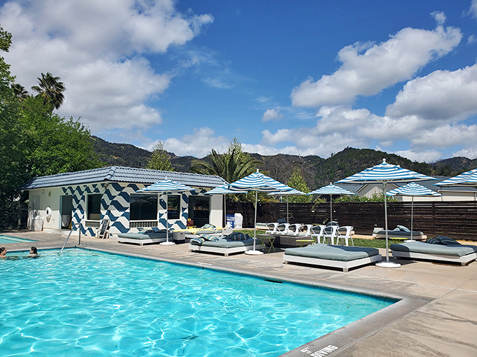 MoonAcre's pool area isn't just a place to swim&mdash;it's where stress goes to drown. Those striped umbrellas are practically begging you to lounge beneath them.