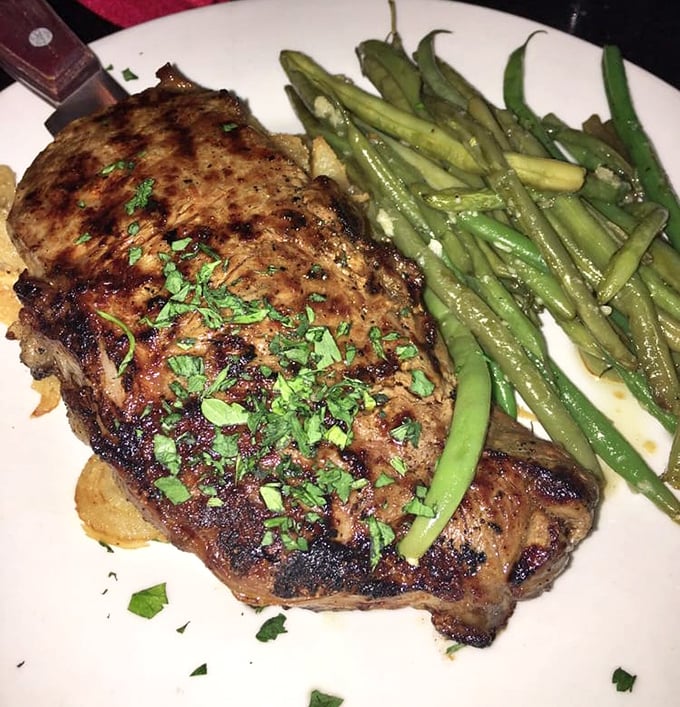 This perfectly seared NY Strip with fresh herbs and green beans isn't just dinner &ndash; it's a religious experience with grill marks.