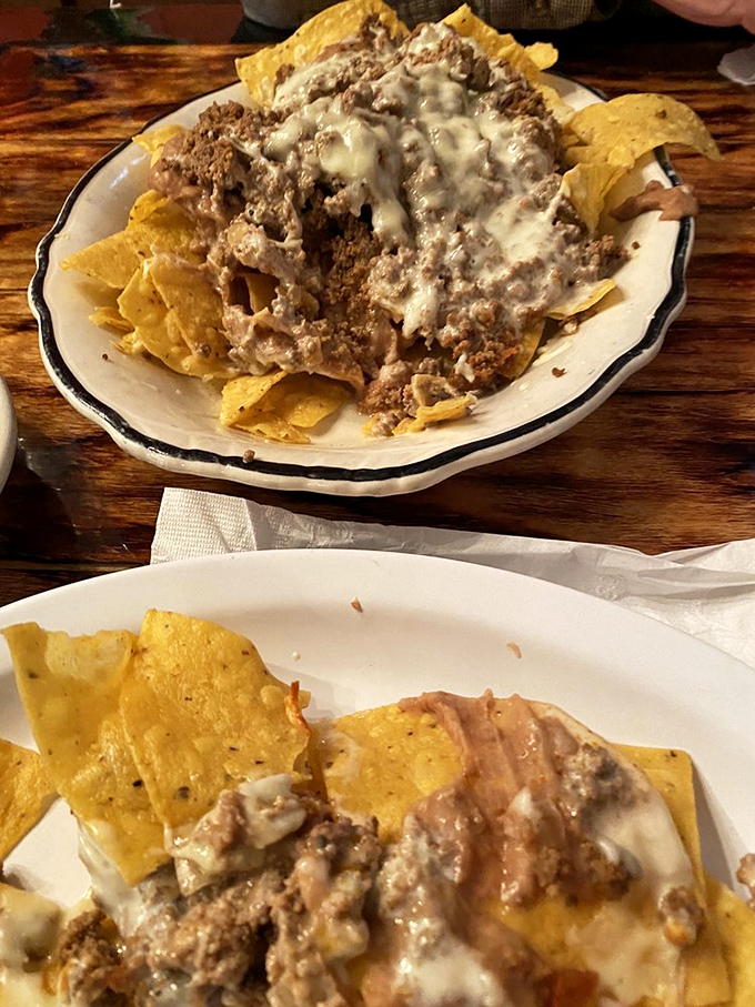Behold the nacho motherlode! Crispy chips disappearing beneath an avalanche of seasoned beef and molten cheese&mdash;resistance is futile.