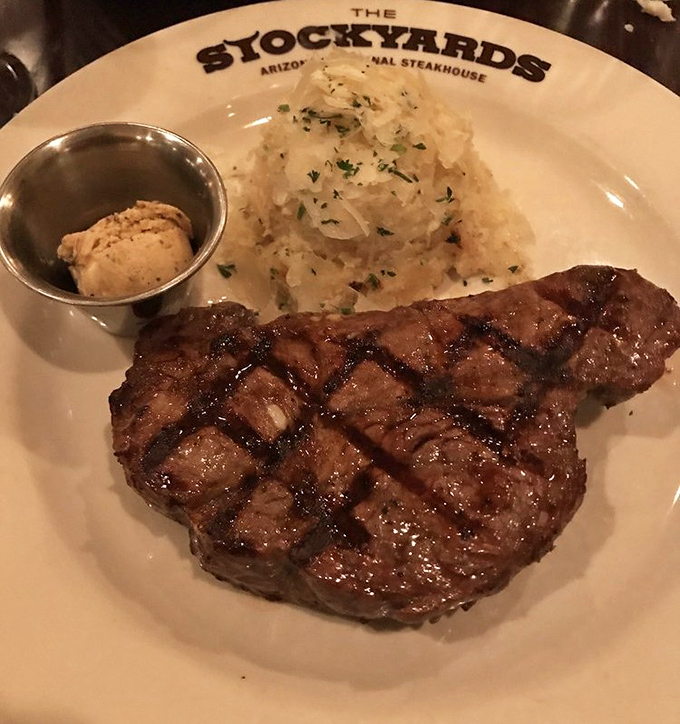 Behold the New York Strip in its natural habitat &ndash; perfectly cross-hatched, glistening with juices, and accompanied by a mountain of mashed potatoes that whispers, "Nap later."