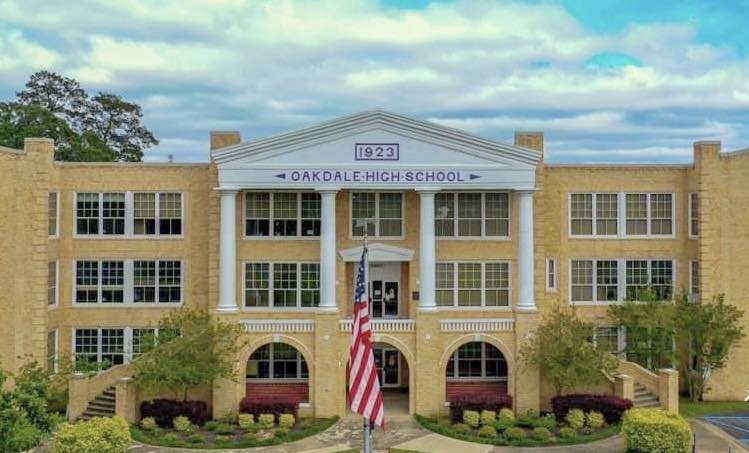 Oakdale High School's impressive 1923 facade stands as a testament to when communities built schools like palaces of learning.