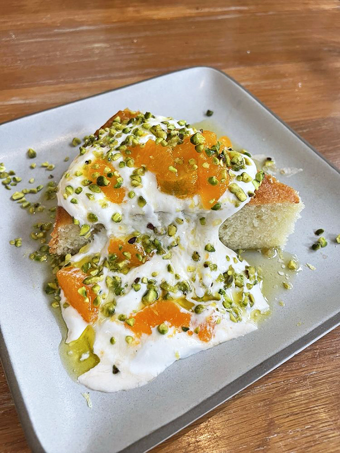 This isn't just olive oil cake—it's a cloud of sweet comfort wearing a crown of pistachios and citrus that makes you question why chocolate gets all the dessert glory.