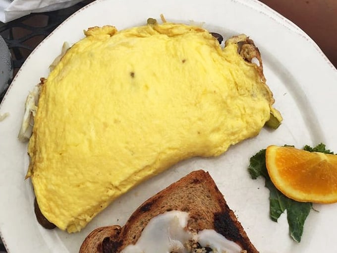 Golden perfection on a plate! This fluffy omelet practically whispers "good morning" with every bite.